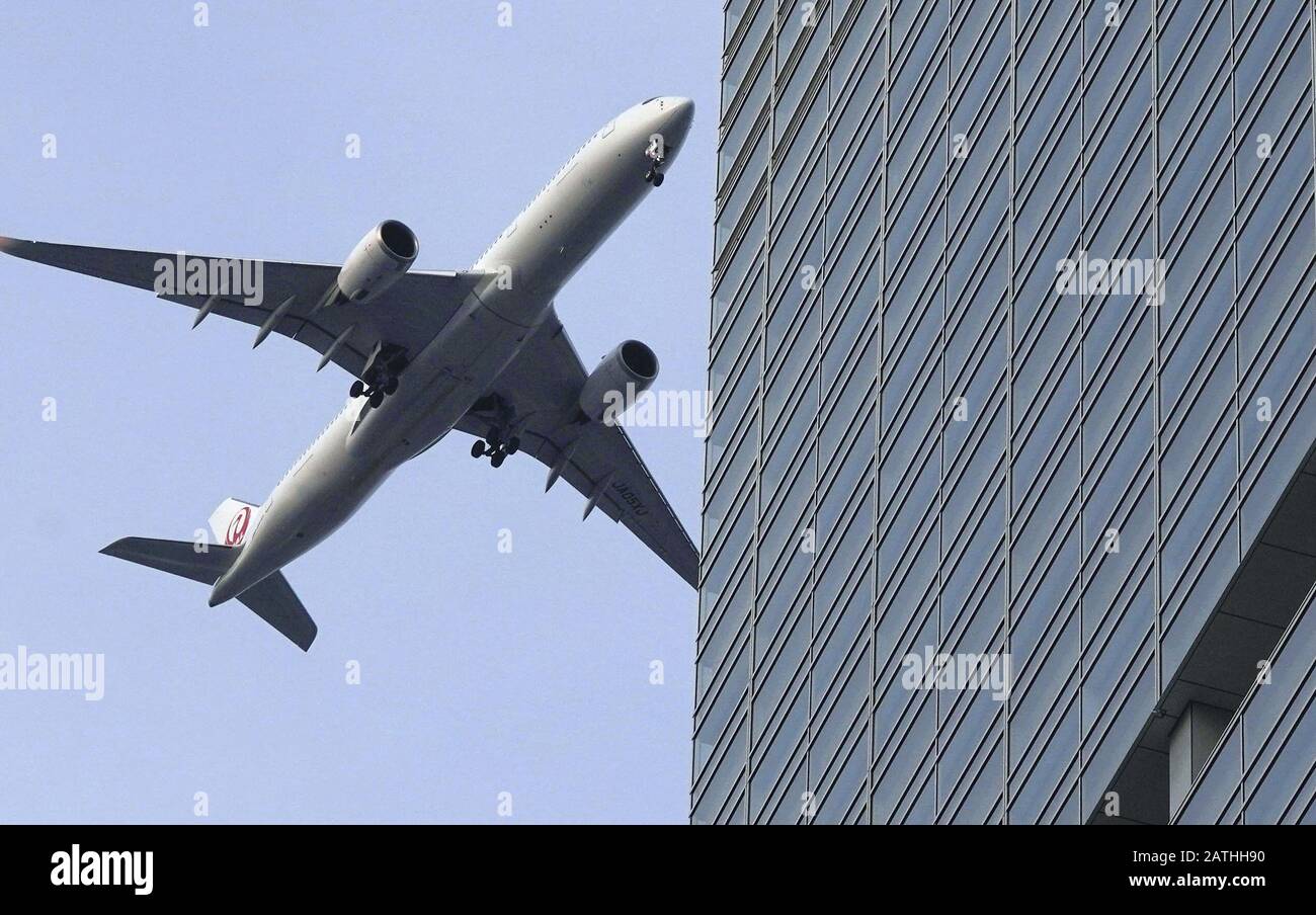 Tokyo, Japan. 03rd Feb, 2020. A plane flies over central Tokyo on Feb ...