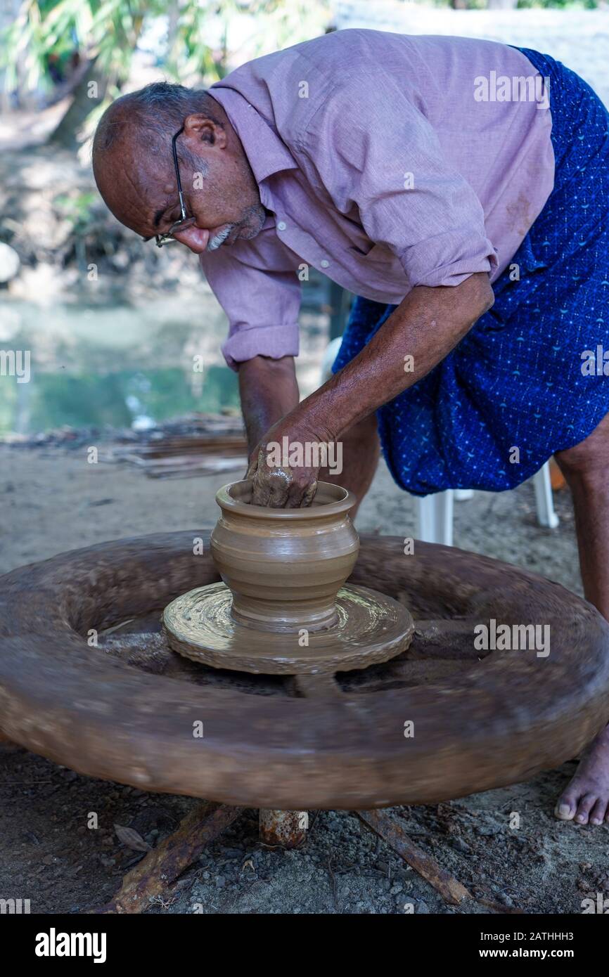 A man demonstrating how to make a pot. From a series of travel photos ...