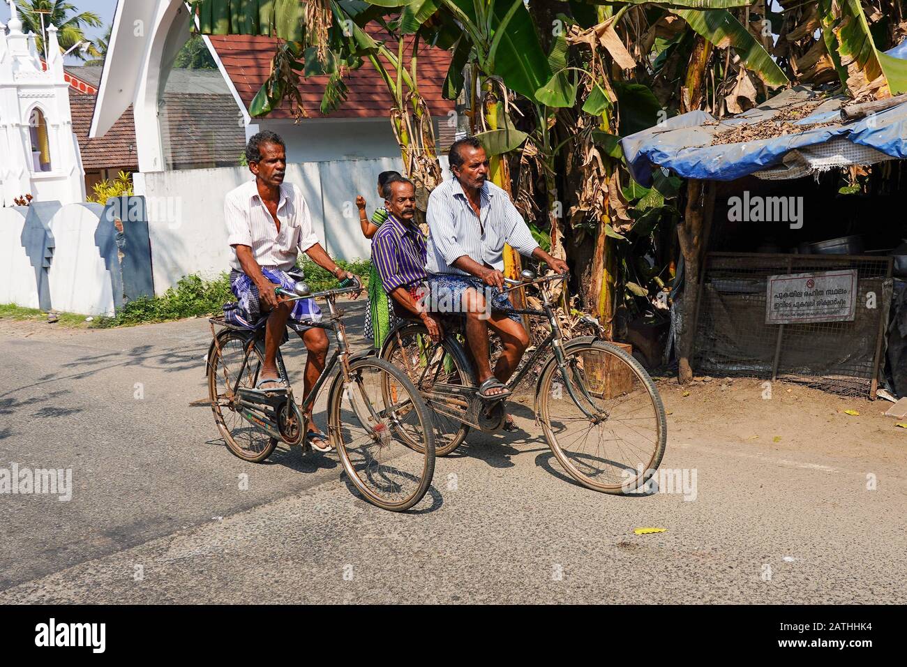 Locals on bicycles. From a series of travel photos in Kerala, South ...
