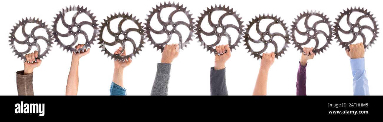 Panorama of different hands holding gears meshing. Group dynamics and ...