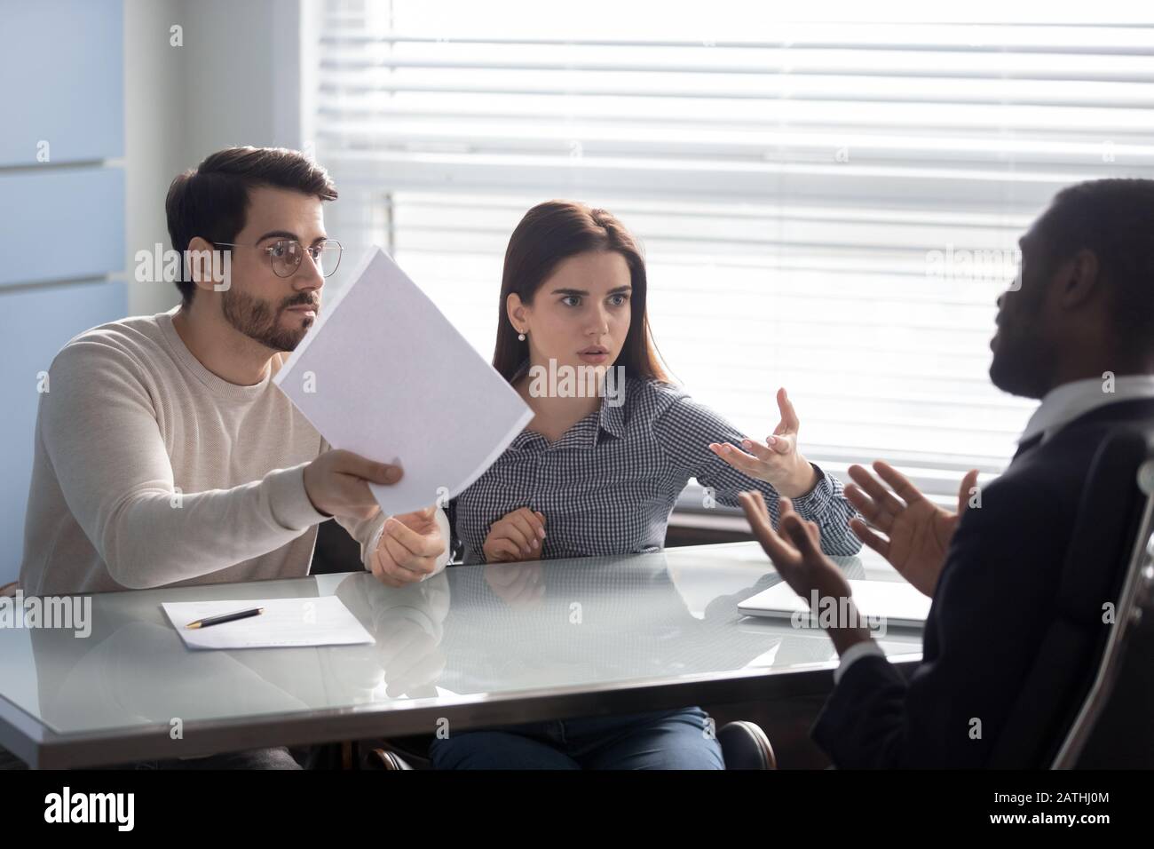 Annoyed couple arguing with bank manager dissatisfied by mortgage rate ...