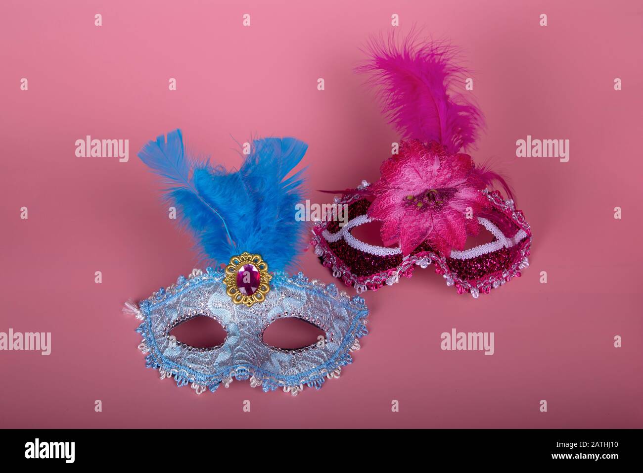 Venetian type masks on pink background. Carnival party concept Stock ...