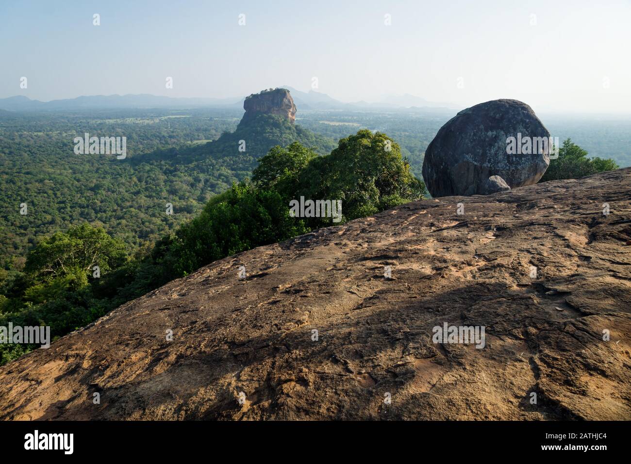 Big Stone on sunny orange Pidurangala Rock with view on Lions Rock ...