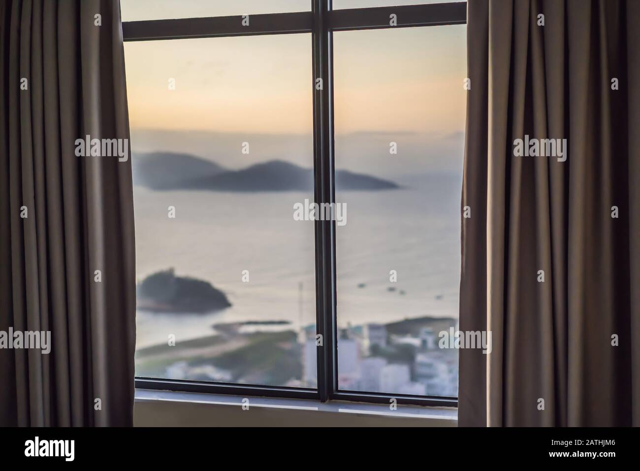 View of tropical beach through hotel window Stock Photo - Alamy