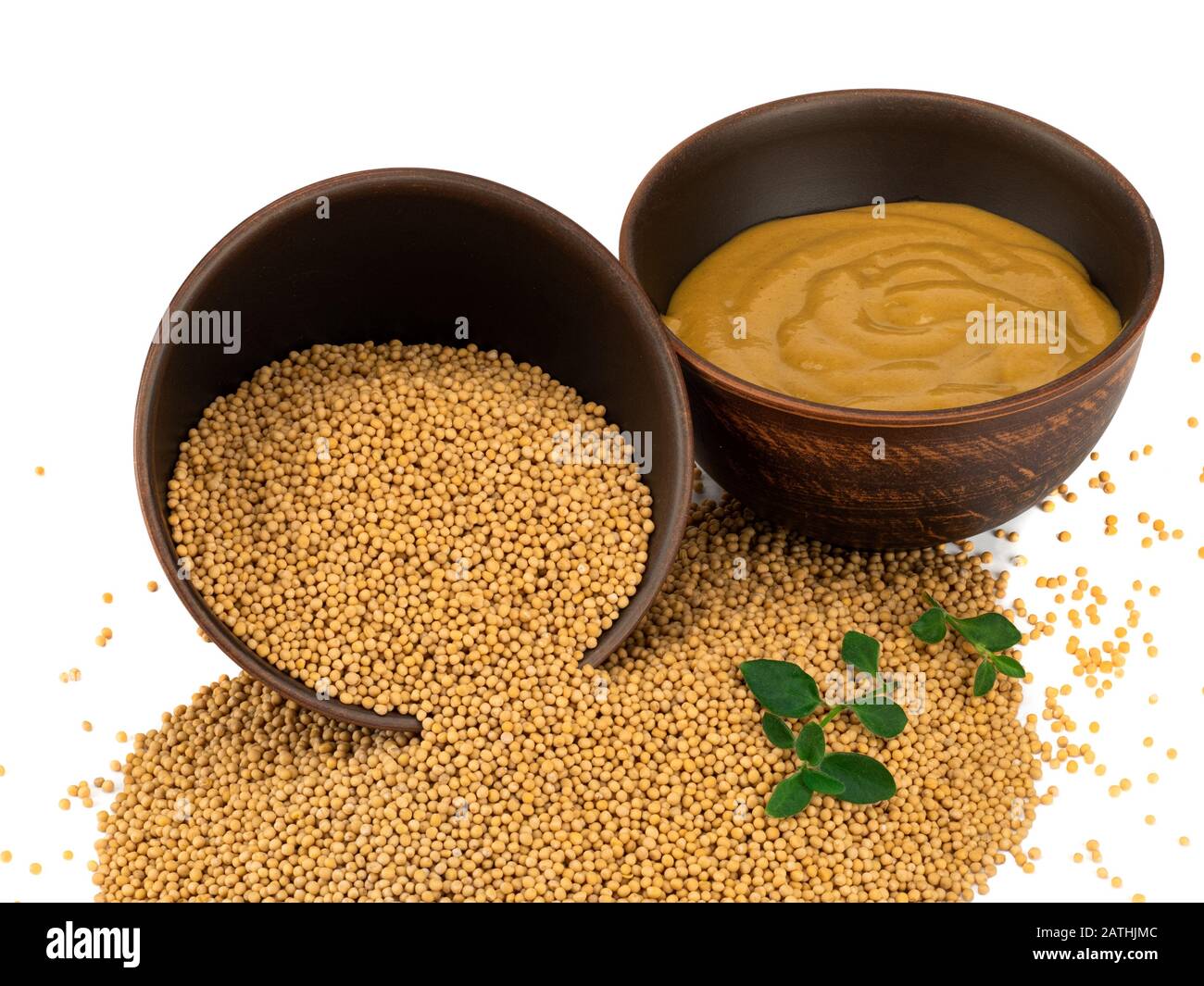 Mustard in plates and mustard seeds Stock Photo - Alamy