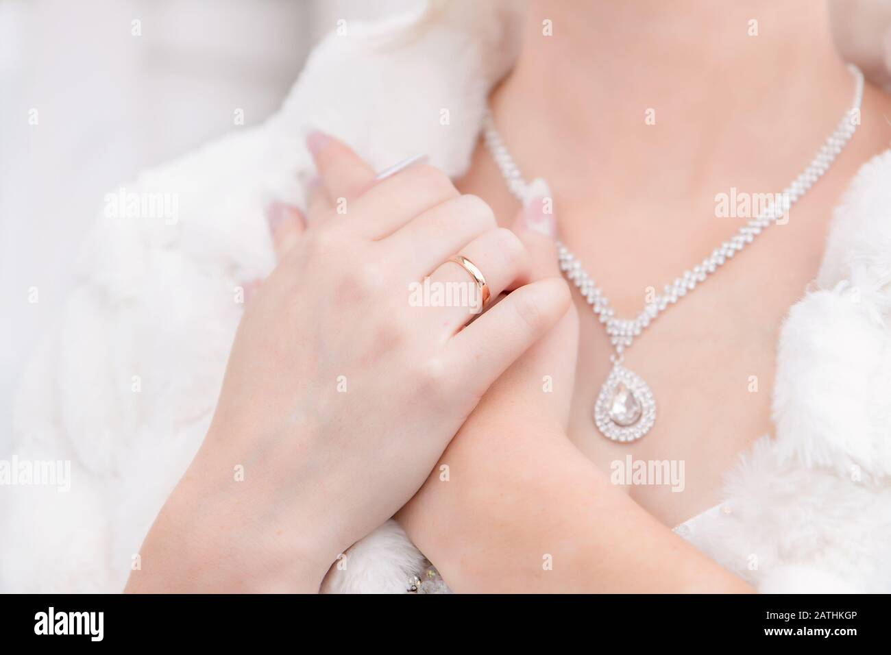 wedding ring on bride's finger Stock Photo - Alamy