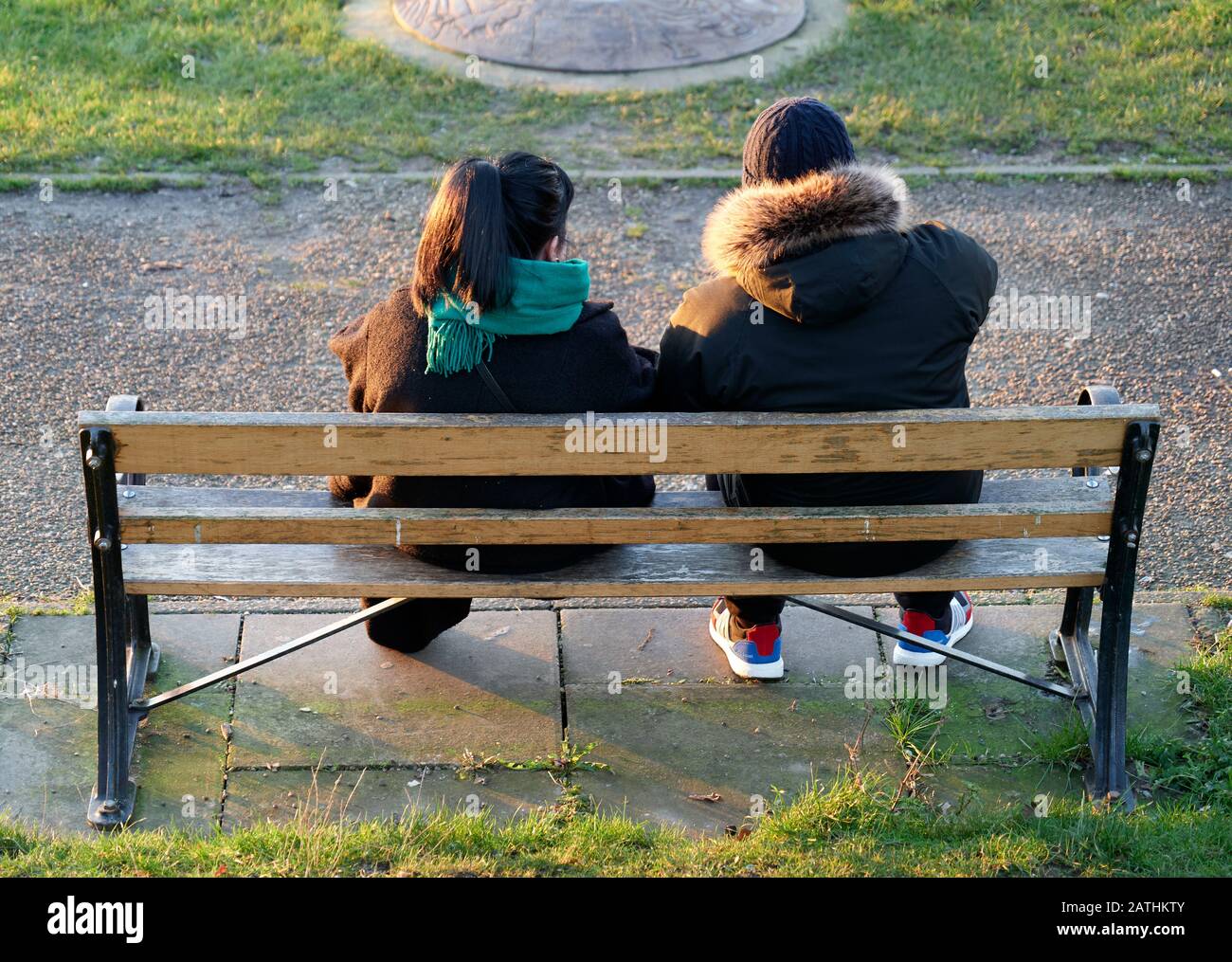 Woman sitting park rear view winter hi-res stock photography and images ...