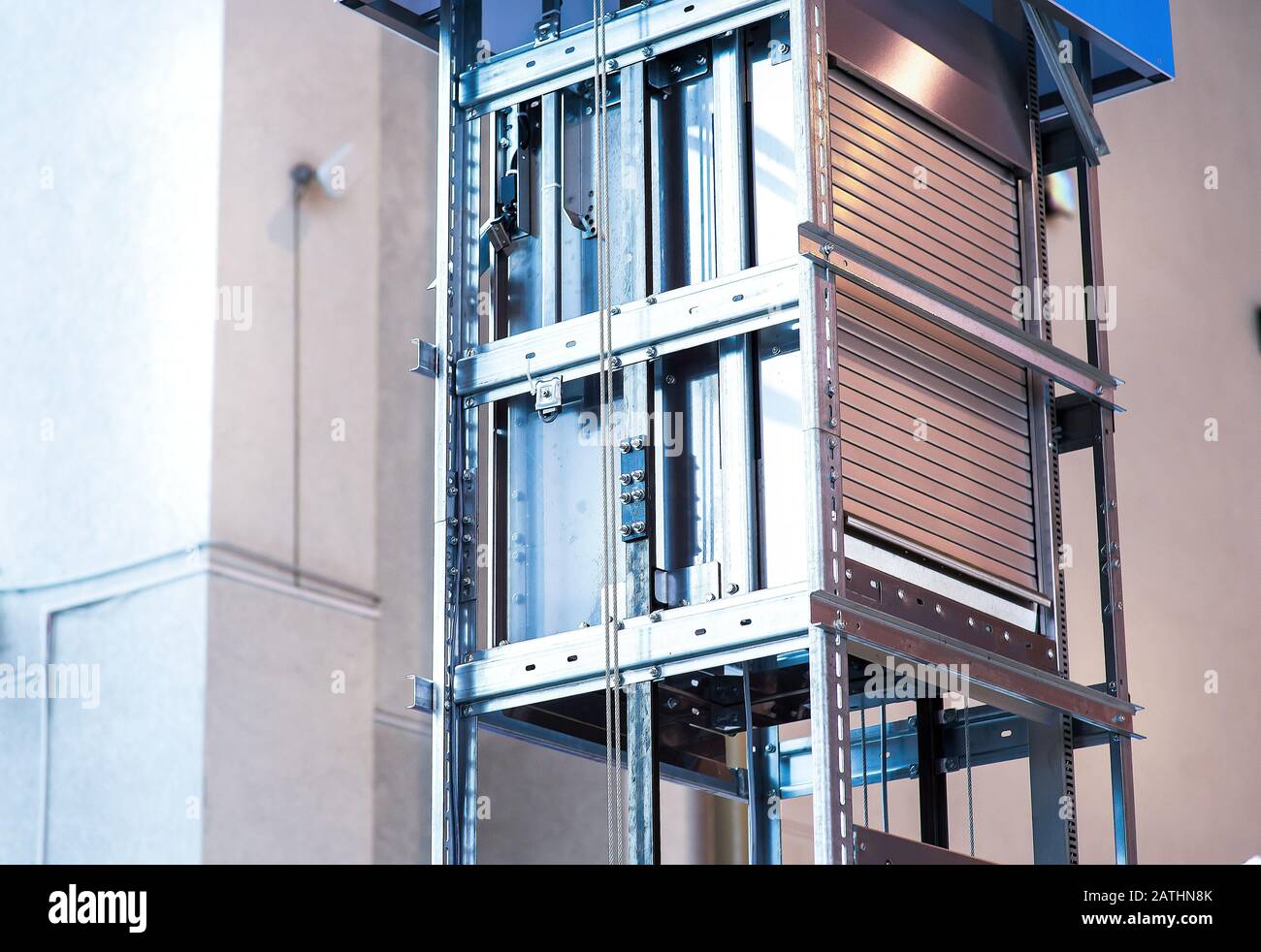 Glass elevator ,Businessman taking modern glass elevator to the upper ...
