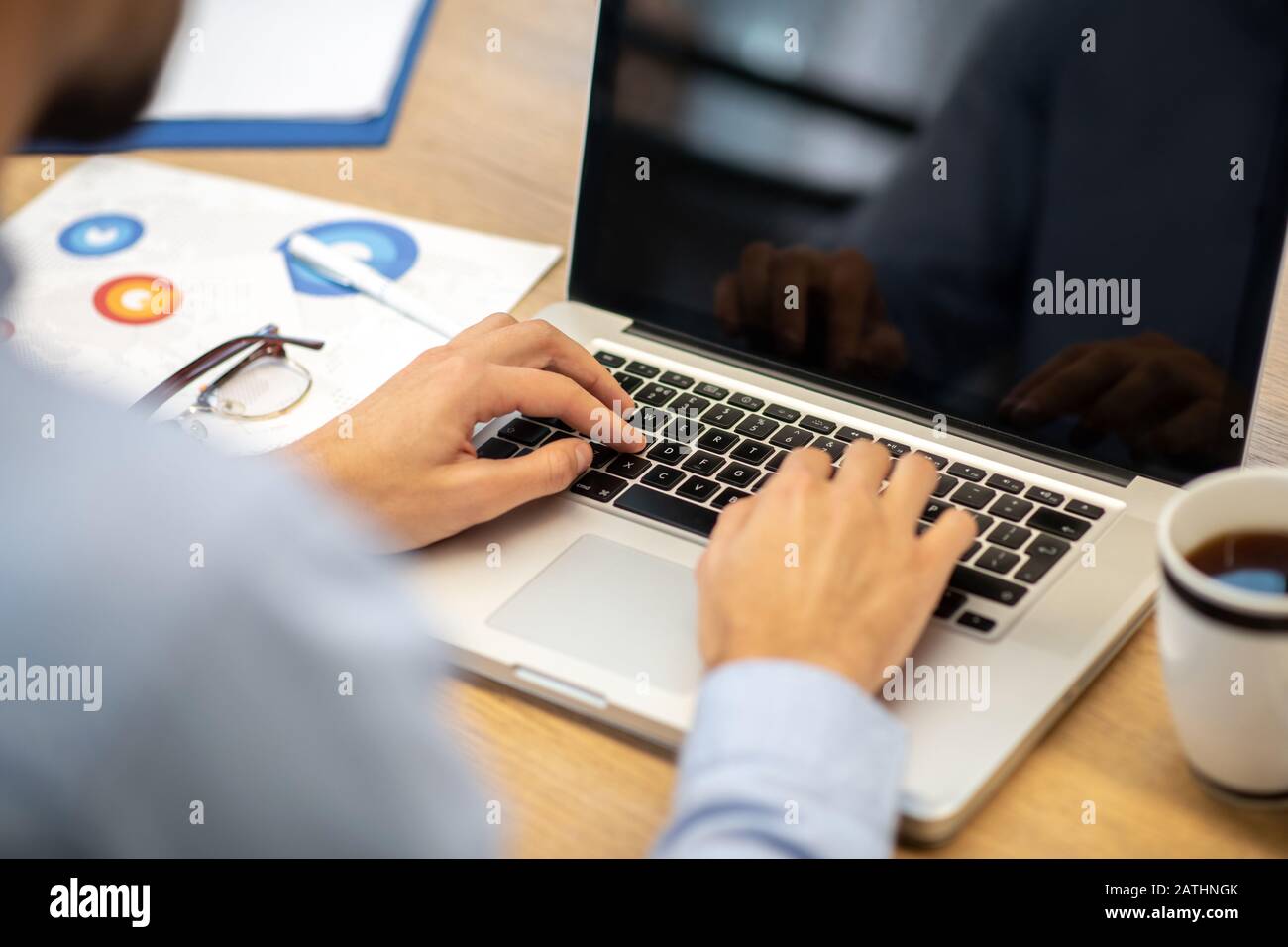 Close up picture of mans hands on a laptop Stock Photo - Alamy