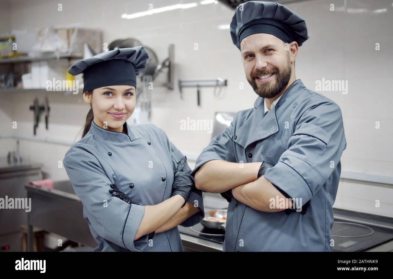 Portrait of a confident male chef with arms crossed in kitchen Stock ...