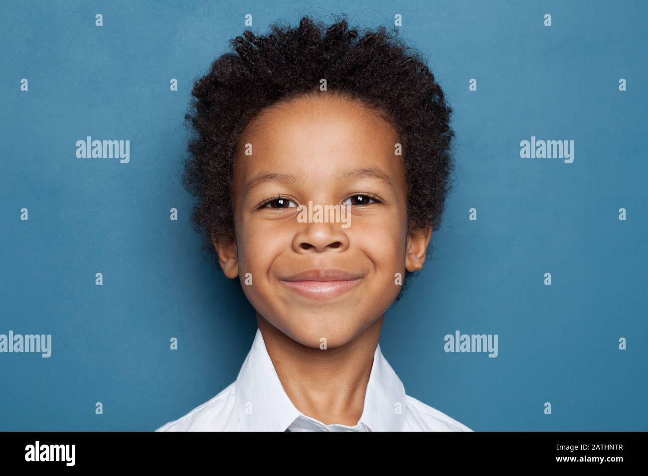 Happy African American Child Boy Smiling on Blue Background. Close up ...