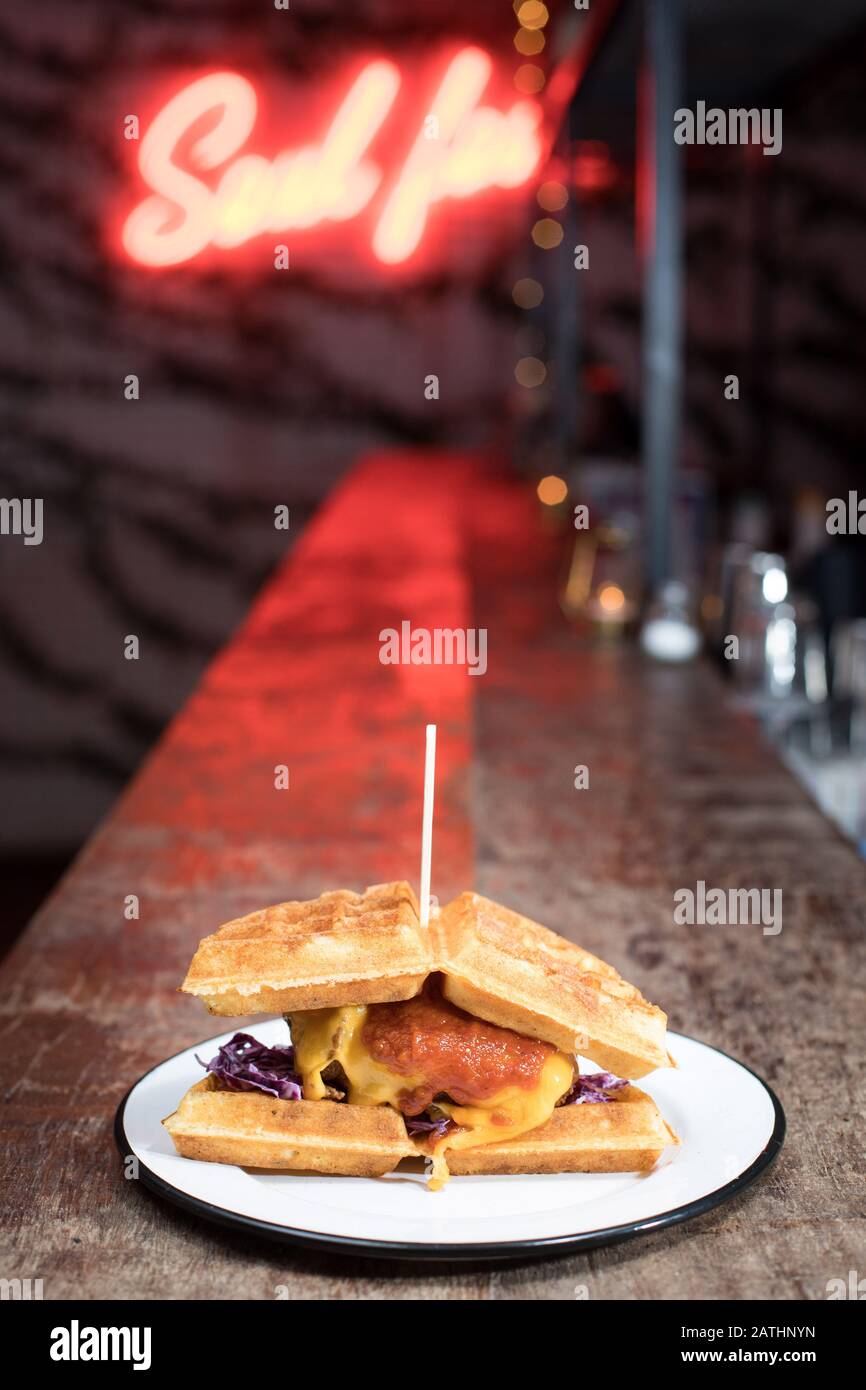 A chicken and cheese waffle sandwich Stock Photo - Alamy