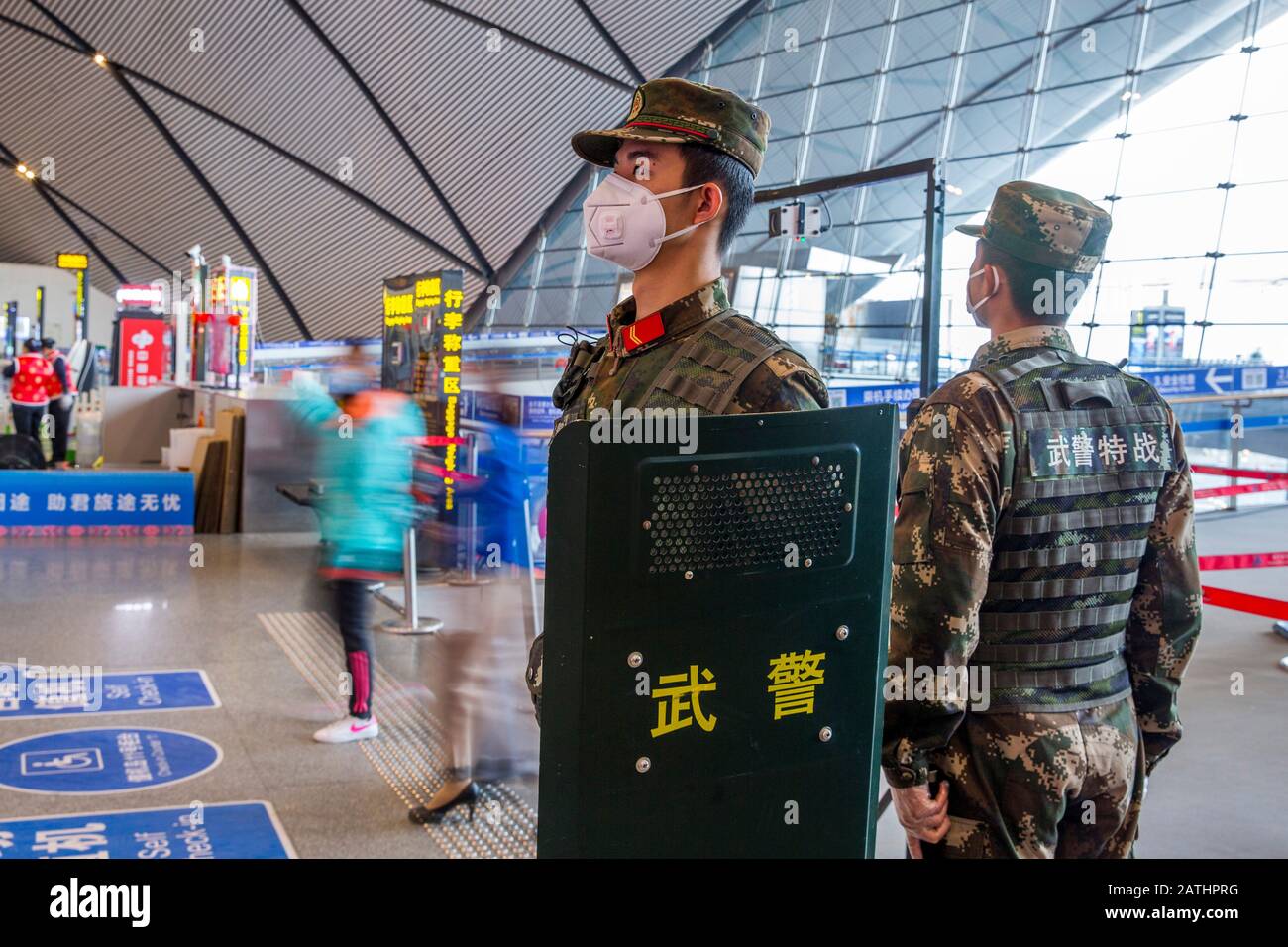 Chinese paramilitary policemen wearing face masks for prevention of the ...