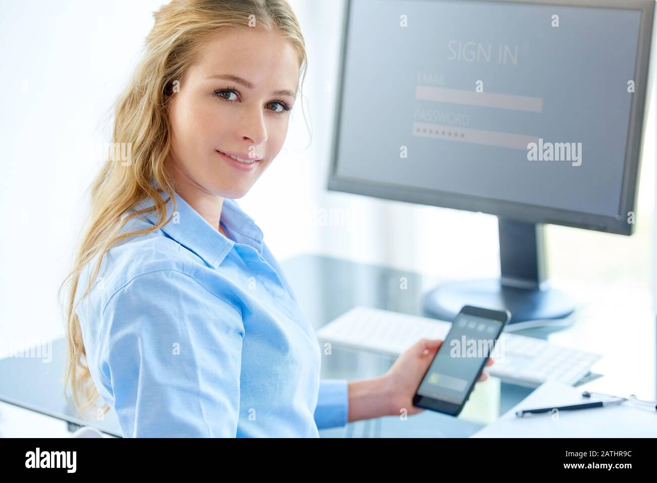 Secretary sitting desk using mobile hi-res stock photography and images ...