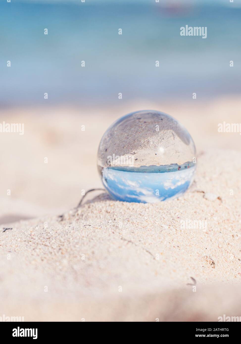 Close-up on Mini Glass Ball on the Beach Stock Photo - Alamy
