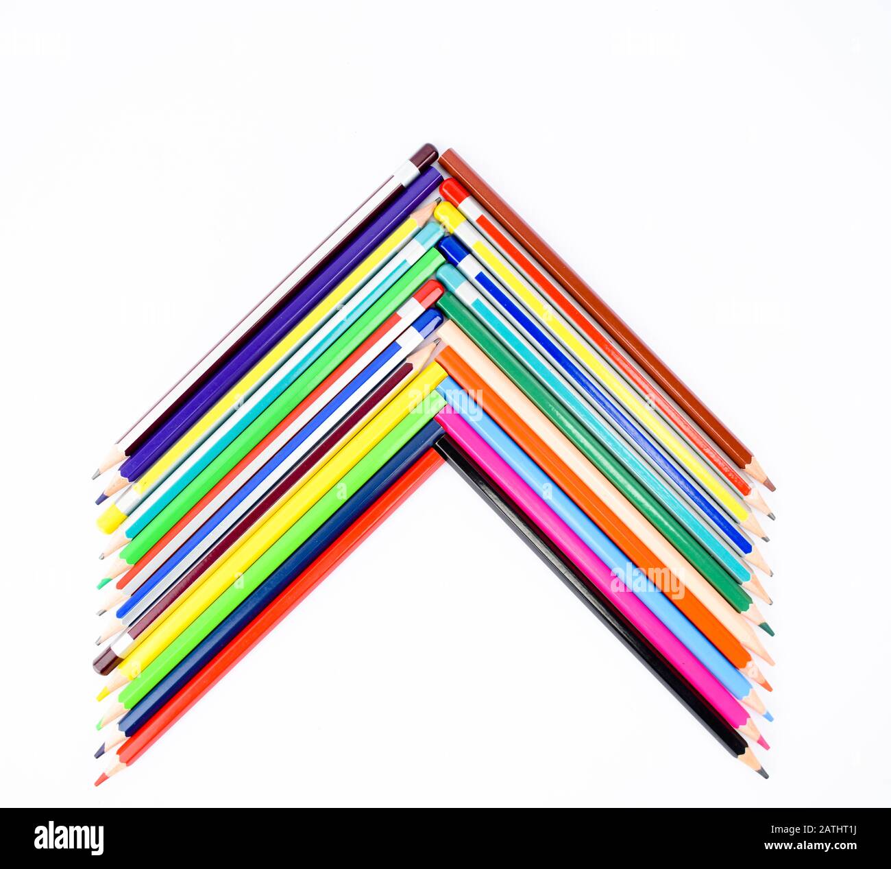 Bunch of different colored wood pencils and crayons stacked together to ...