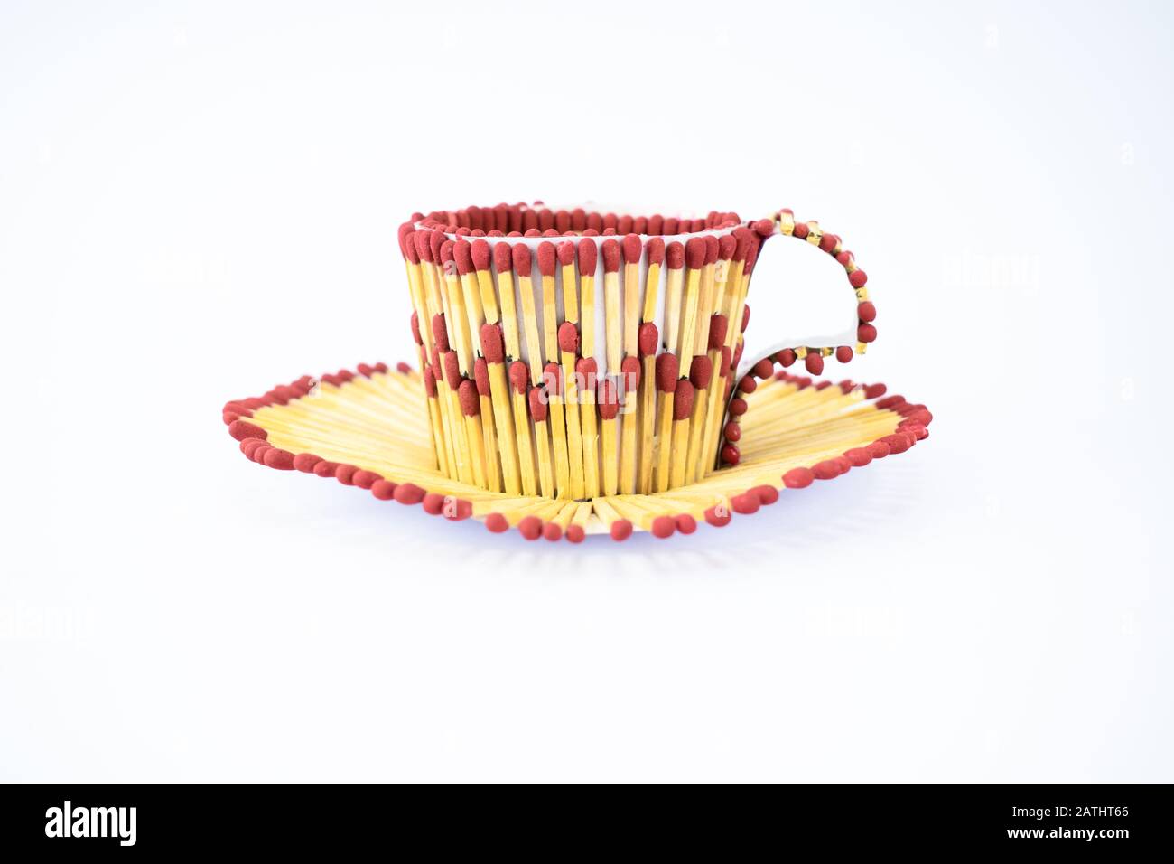 Portrait of a tea cup made of fire matches isolated in a white ...
