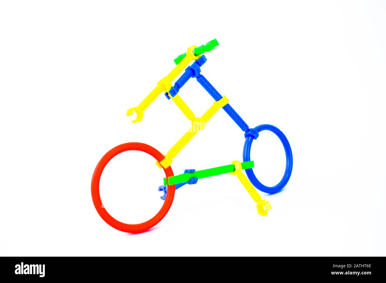 Side view pf a bicycle made of plastic shape shifting toy on a white ...