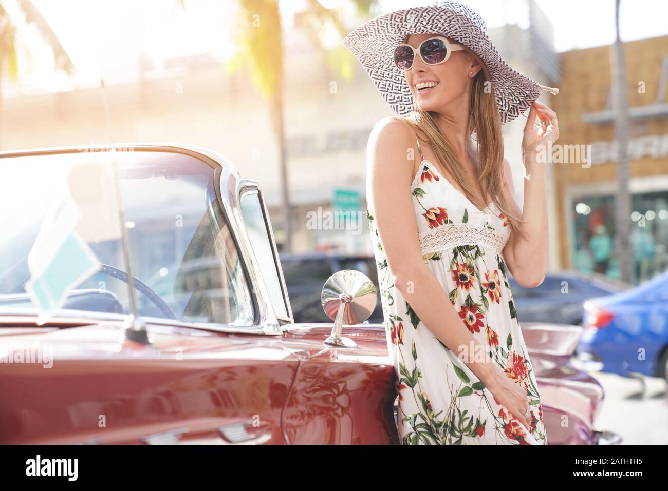 Model posing by old-fashioned car Stock Photo - Alamy