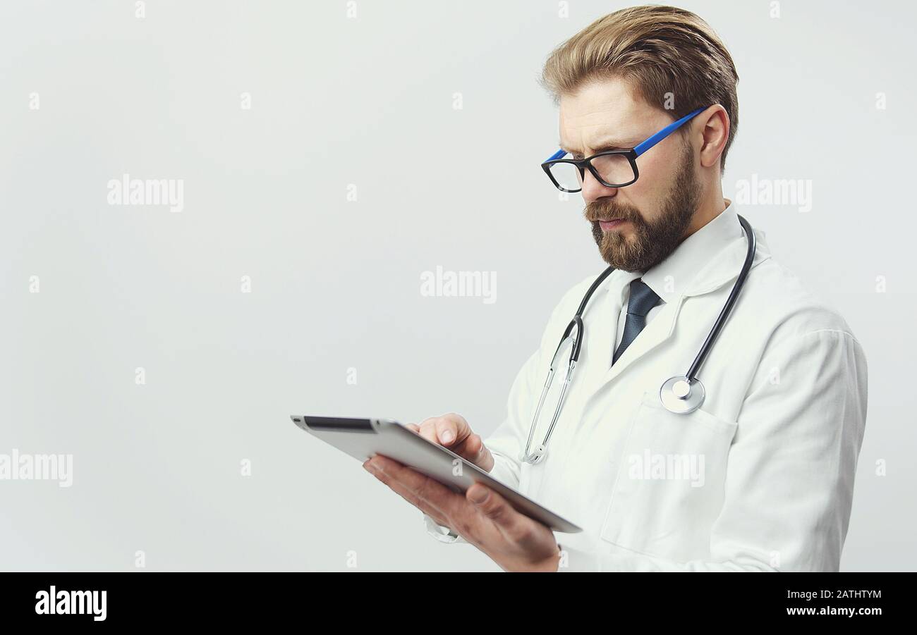 Medical man using pad Stock Photo - Alamy