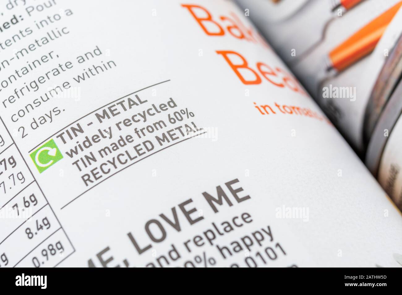 Close up baked bean can label showing package recycling information ...