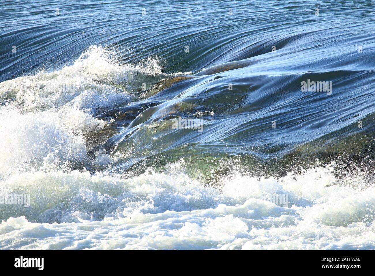 Water splashing in fast river flow Stock Photo - Alamy