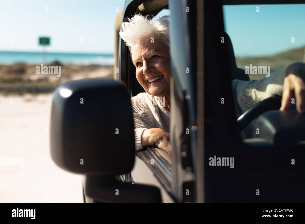 Old woman driving car hi-res stock photography and images - Alamy