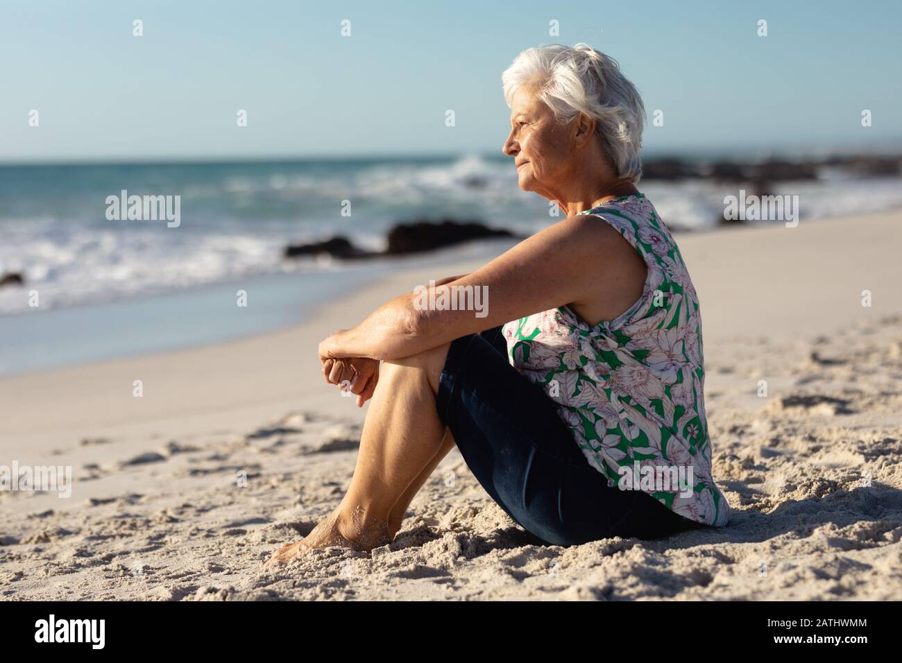 Old woman enjoying free time Stock Photo - Alamy