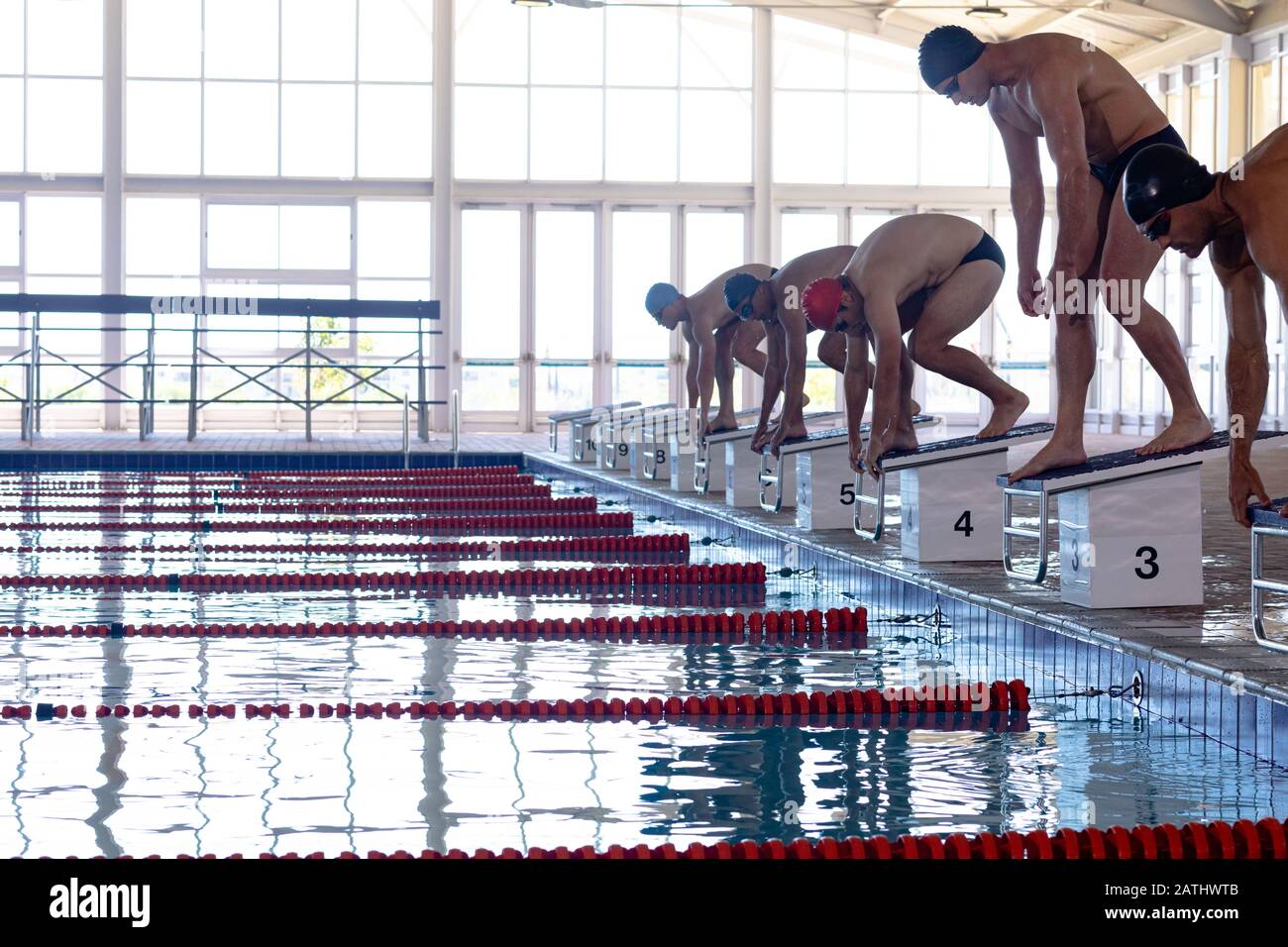 Swimmers ready to plunge Stock Photo - Alamy