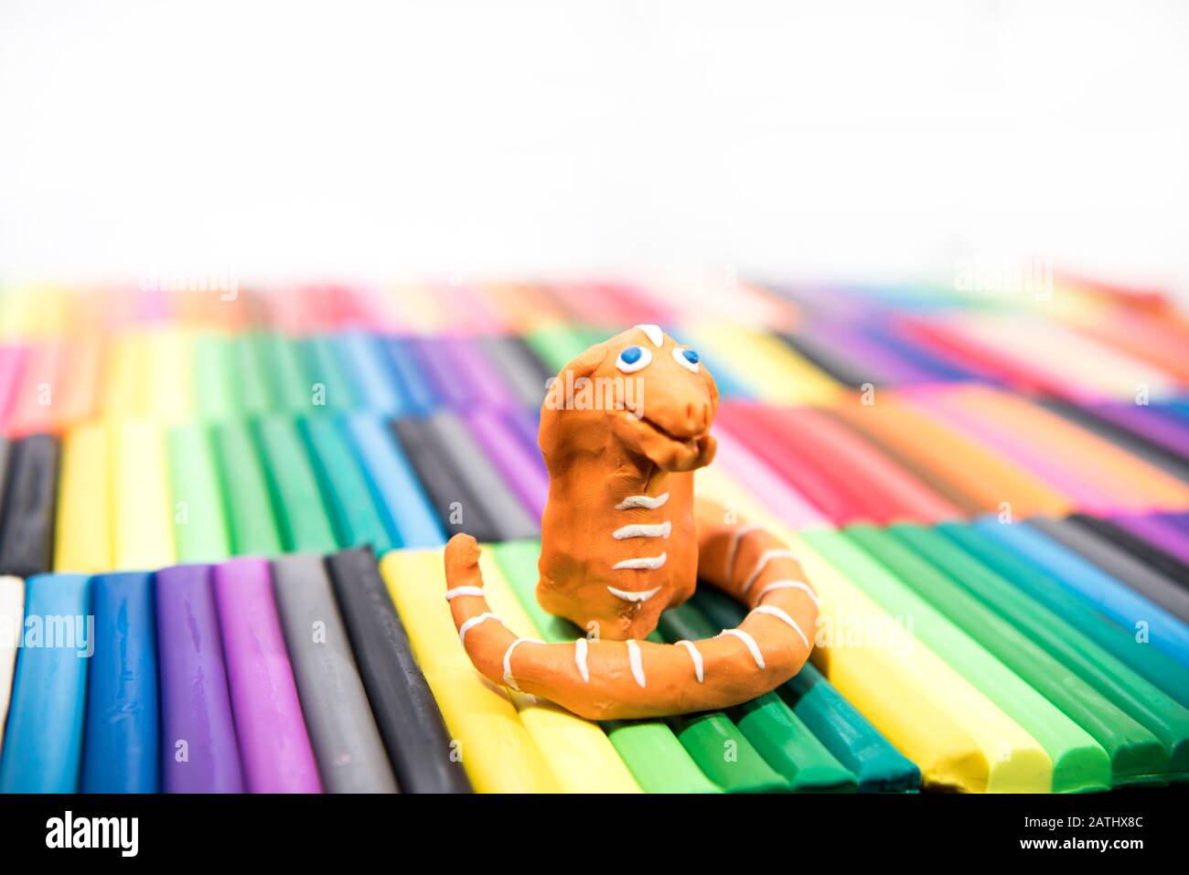 Play clay Animals. Cobra on colored background Stock Photo - Alamy