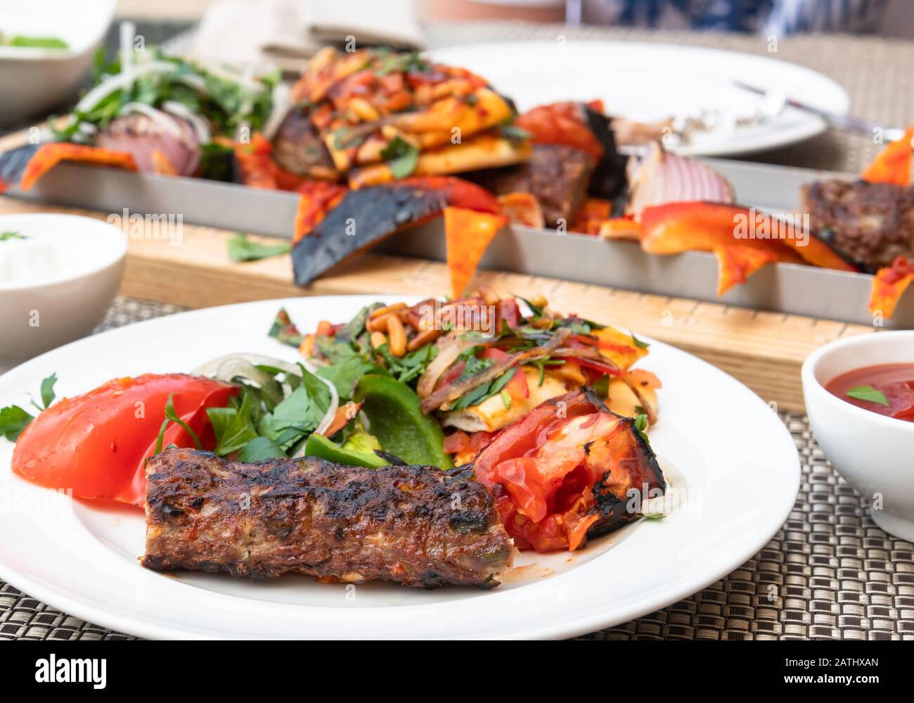 Kebab with vegetables and pita bread - traditional Turkish dish. Cooked ...