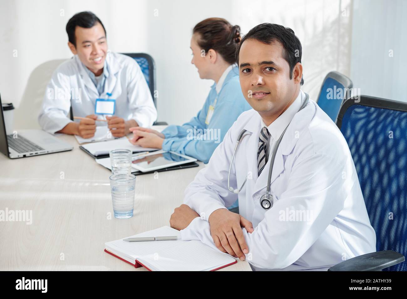 Positive general practitioner attending hi-res stock photography and ...