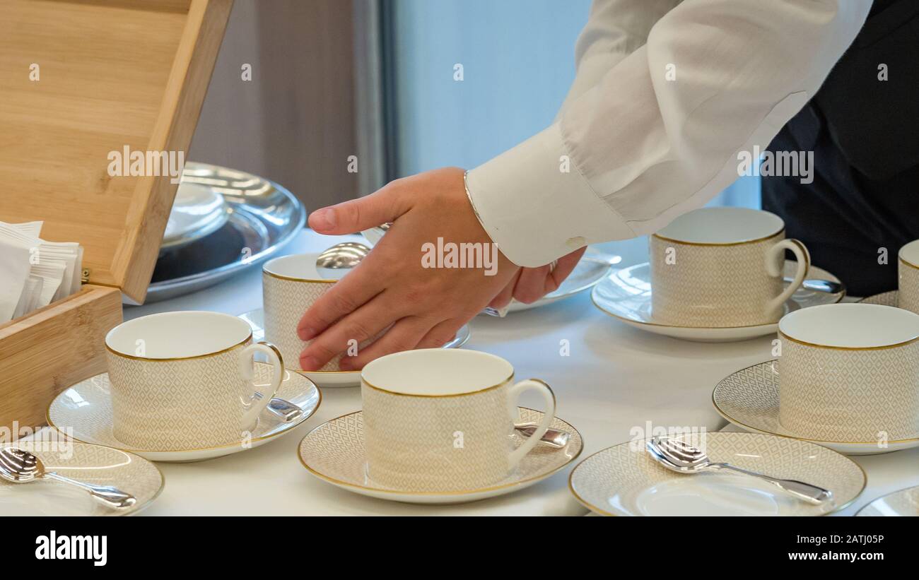 Waitress serving tea hospitality hi-res stock photography and images ...