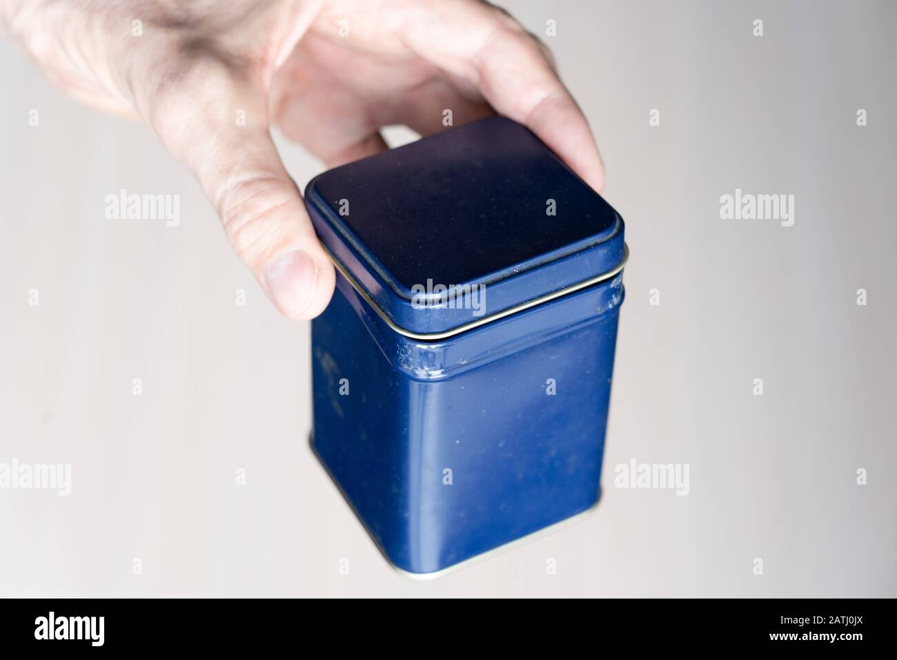 Antique blue tin can for tea or coffee. Small Metal box Stock Photo - Alamy