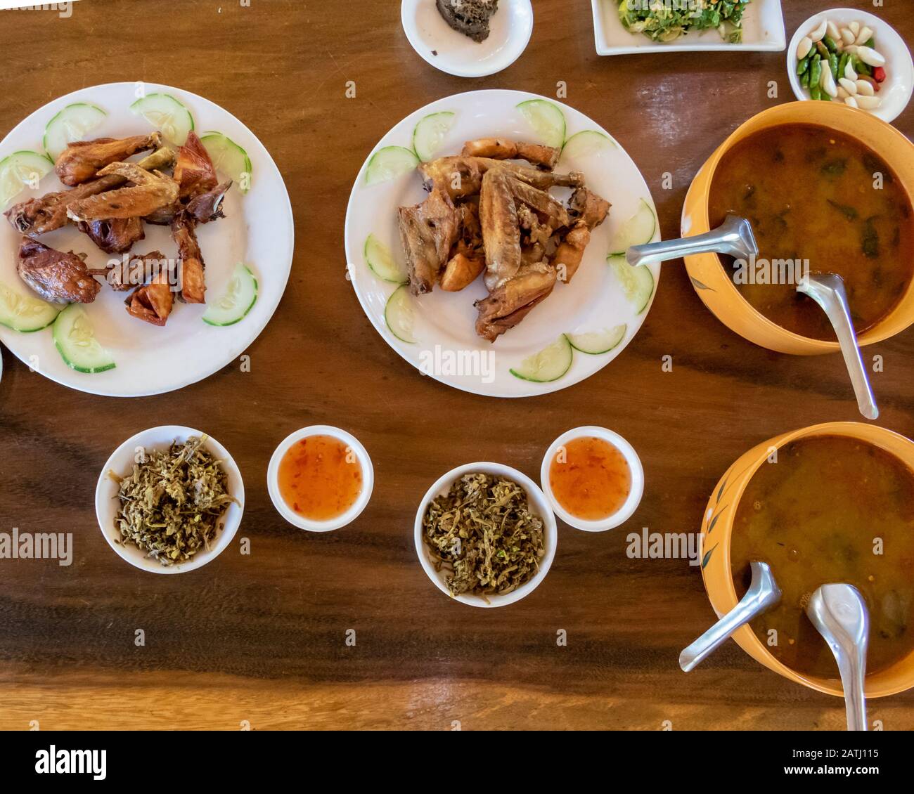 Selection of burmese dishes in rural Myanmar with skinny chicken and ...