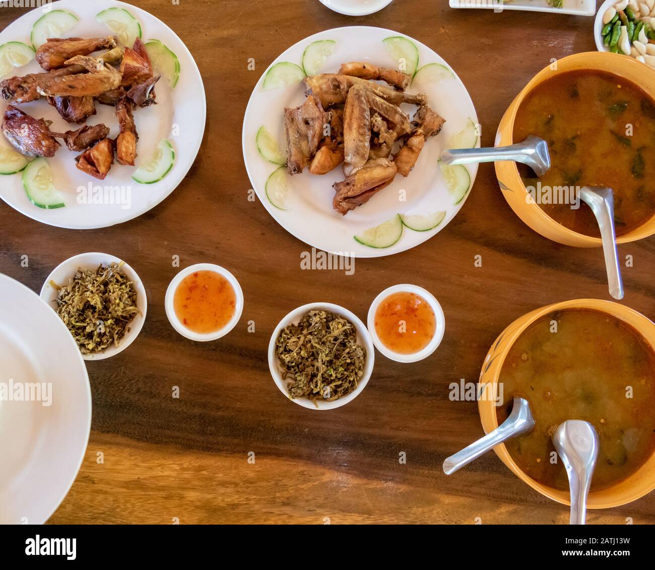 Selection of burmese dishes in rural Myanmar with skinny chicken and ...