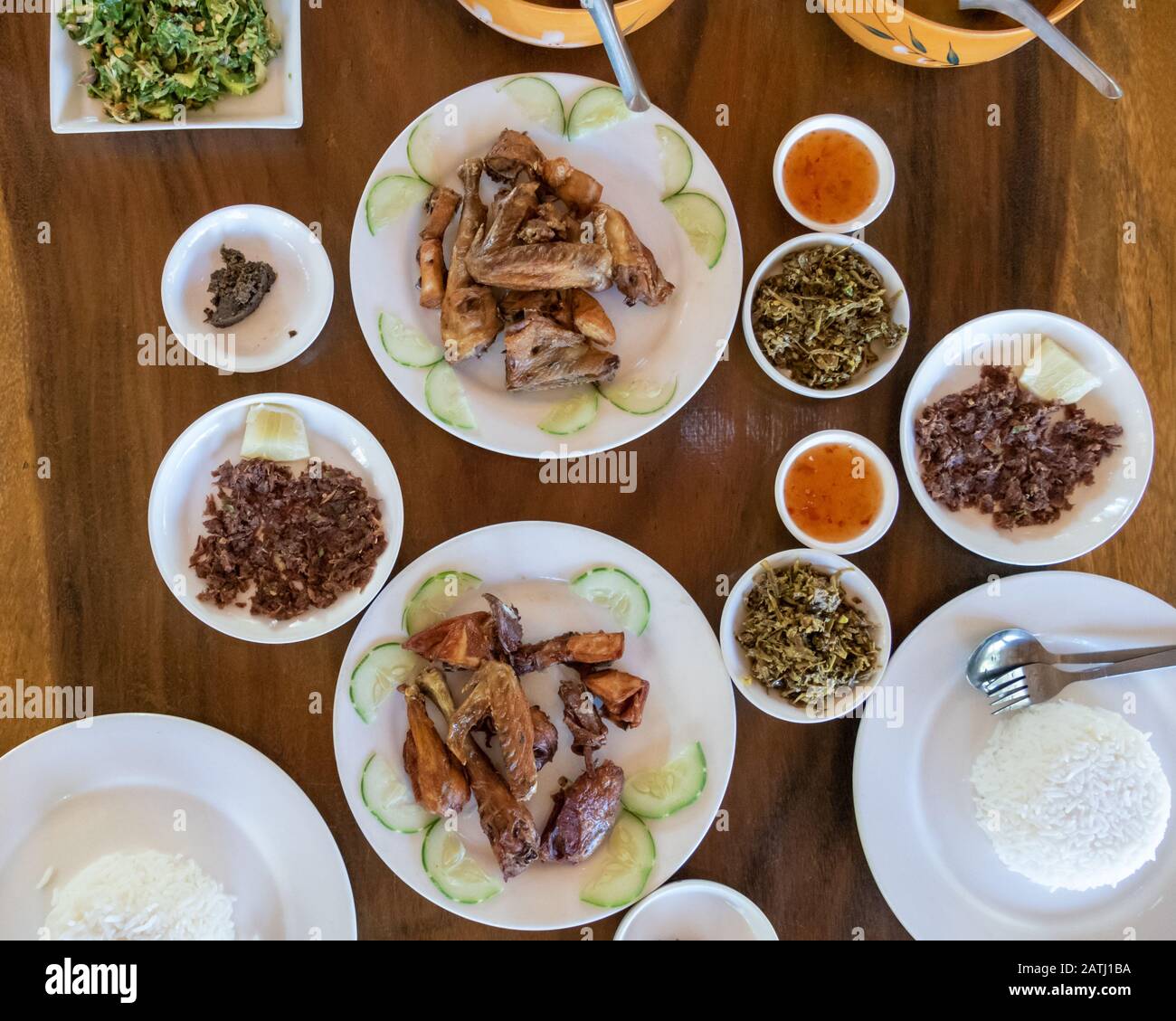 Selection of burmese dishes in rural Myanmar with skinny chicken and ...