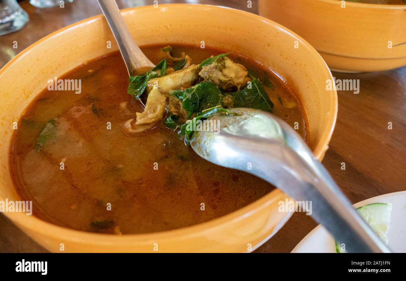 Selection of burmese dishes in rural Myanmar with skinny chicken and ...