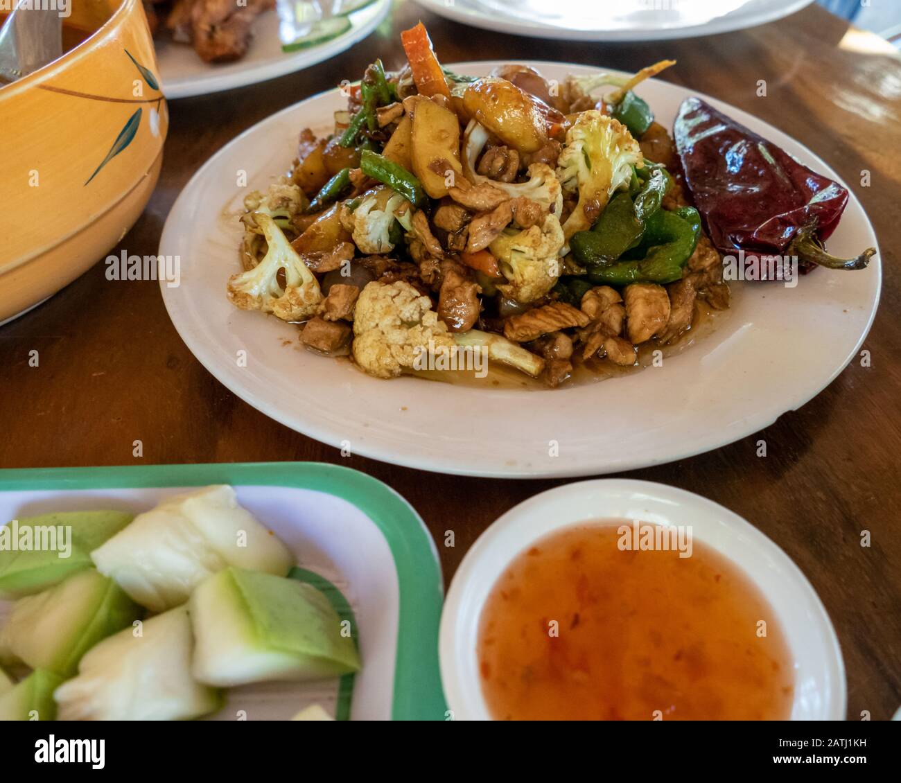 Selection of burmese dishes in rural Myanmar with skinny chicken and ...