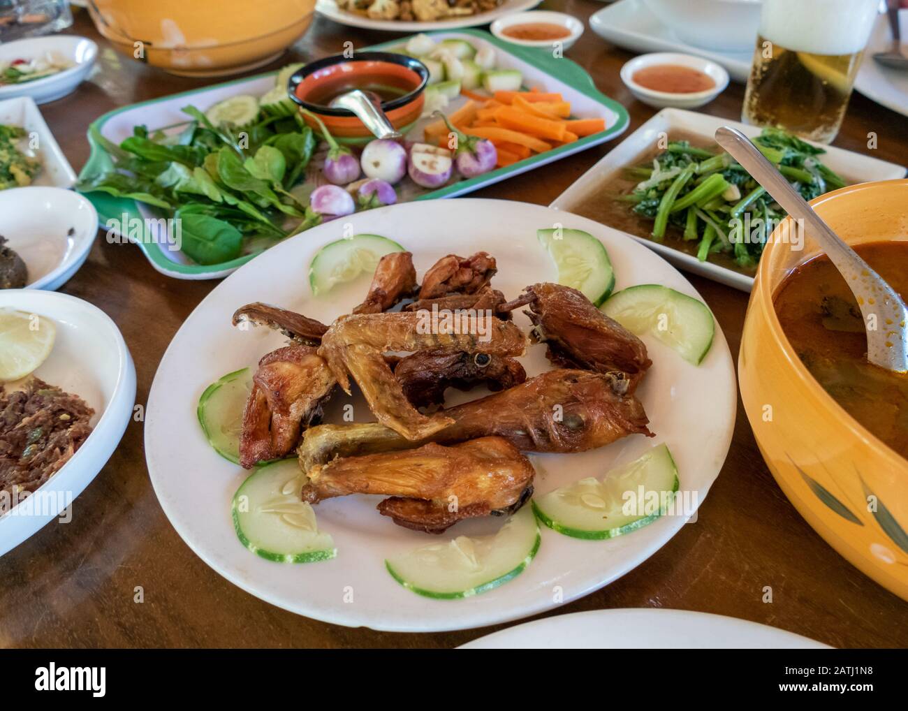 Selection of burmese dishes in rural Myanmar with skinny chicken and ...