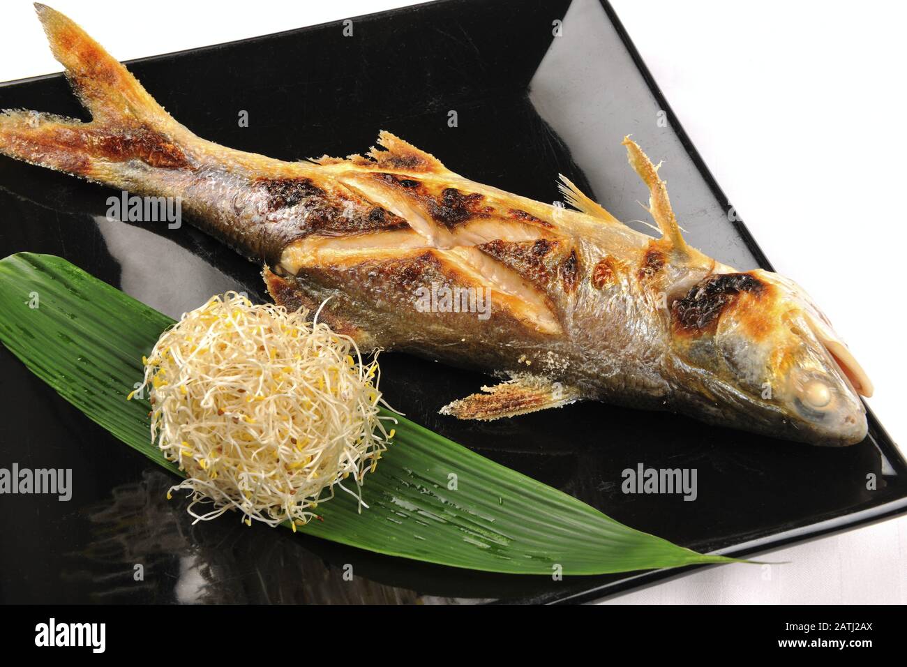Food portrait of roast fish Stock Photo - Alamy