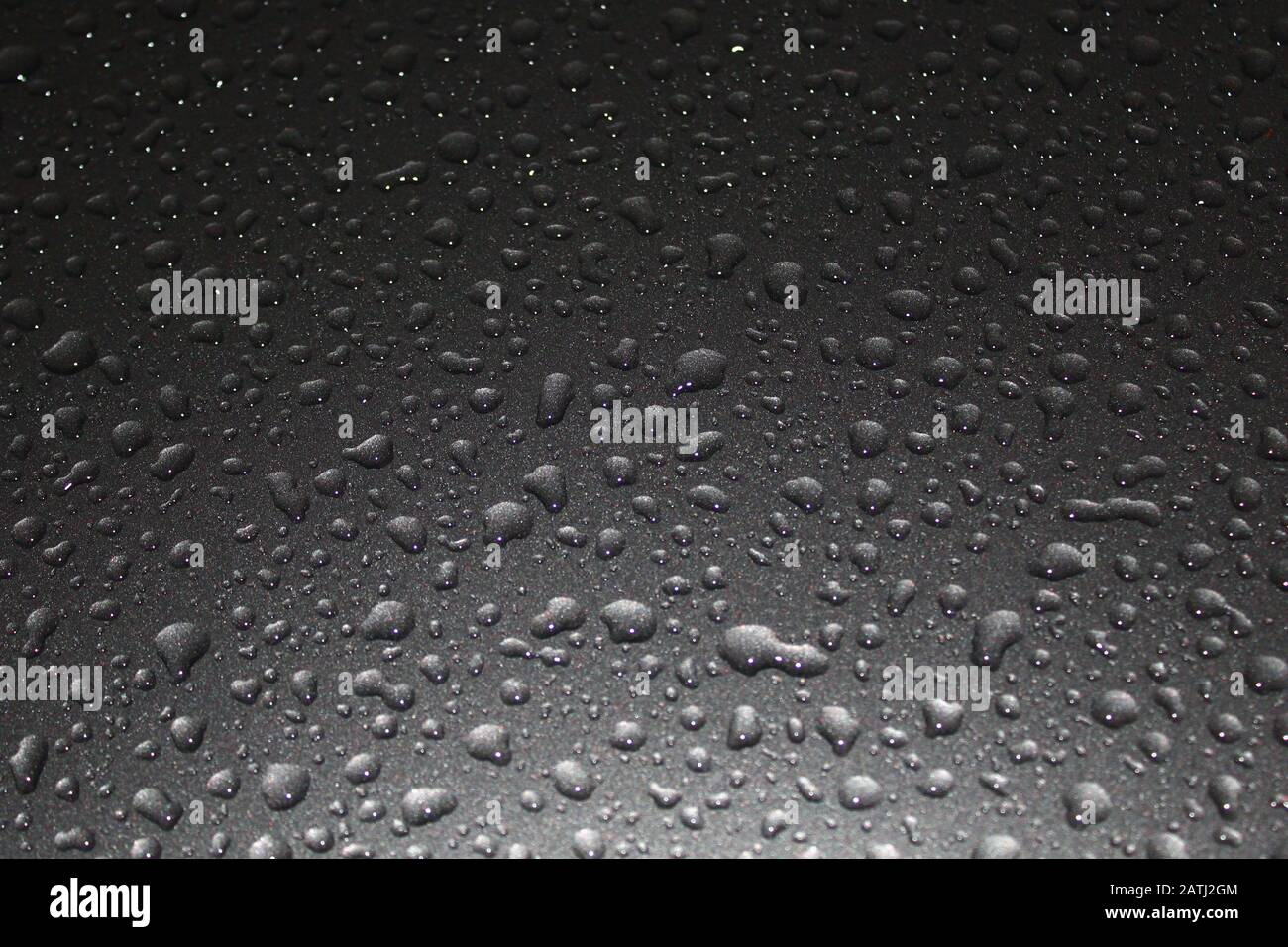 The picture shows raindrops on a grey surface Stock Photo - Alamy