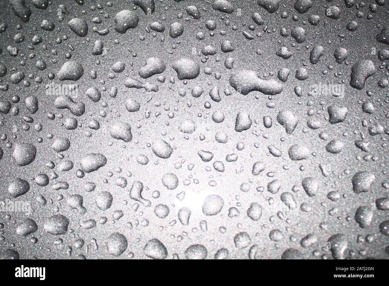 The picture shows raindrops on a grey surface Stock Photo - Alamy