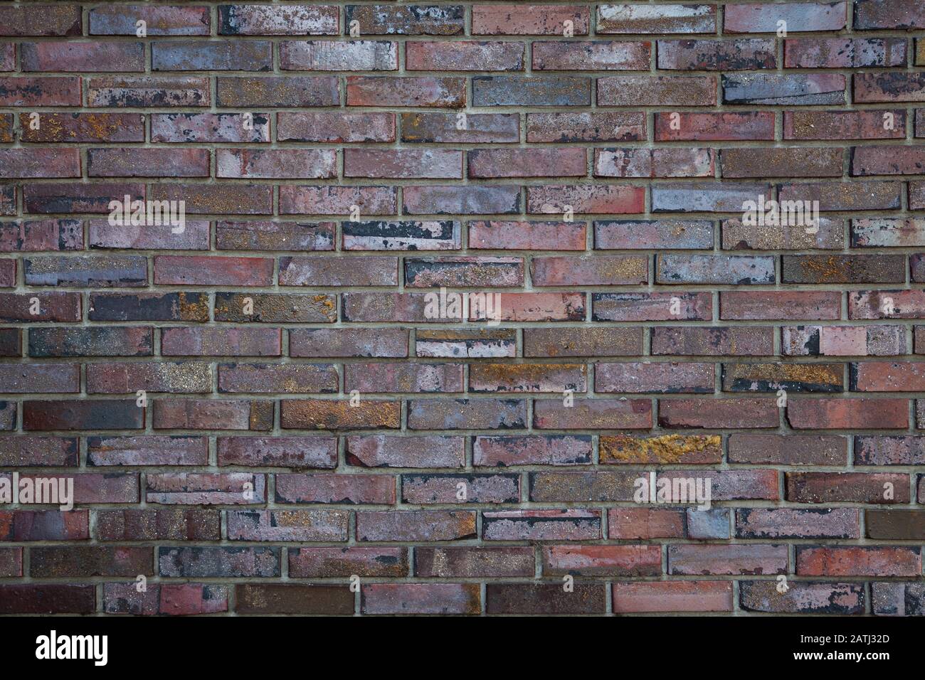 Brick wall, multi-colored decorated brick wall close-up Stock Photo - Alamy
