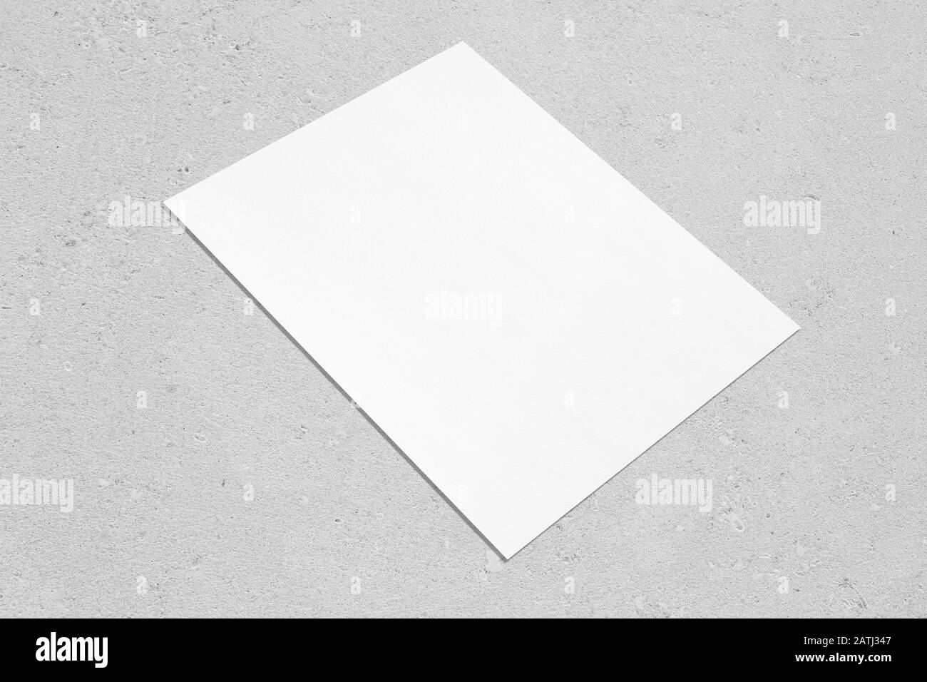 empty white rectangle poster mockup lying diagonally on neutral grey ...