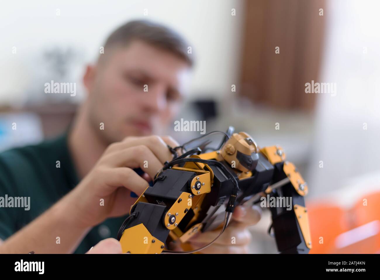 Scientists engineers designing small human robot, setting artificial ...