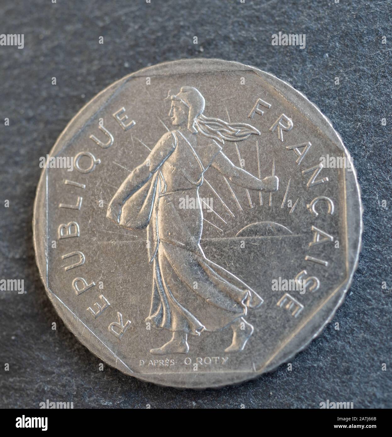 closeup of a French Republic coin depicting the time of sowing while ...