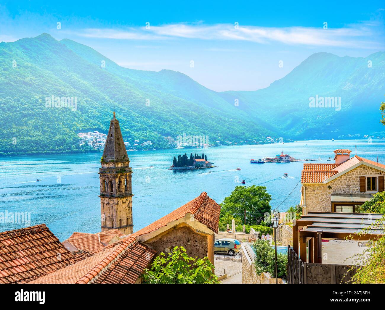 Belltower of St Nicholas church and famous islands in Perast ...