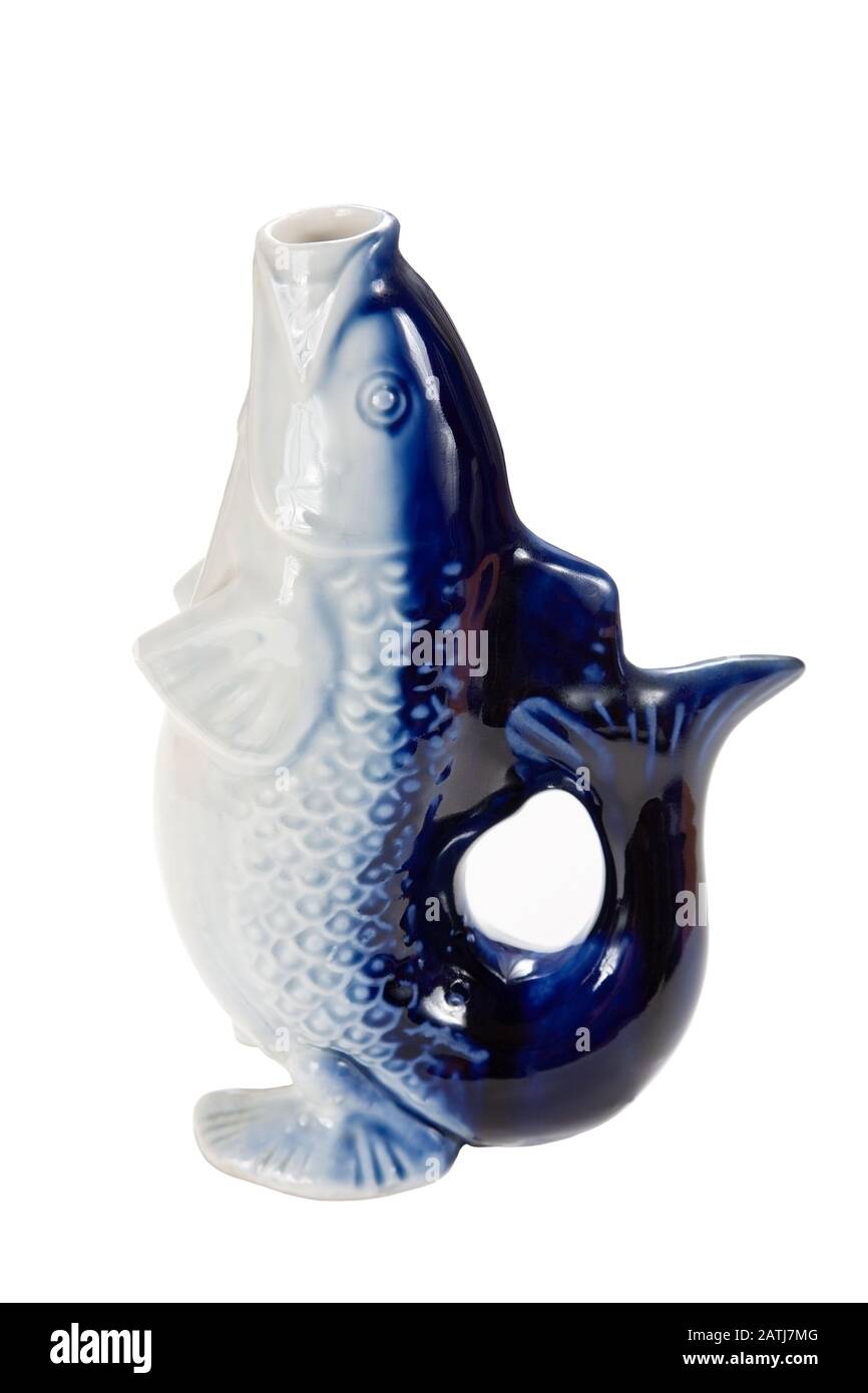 Porcelain carafe in the form of a fish on a white background Stock ...