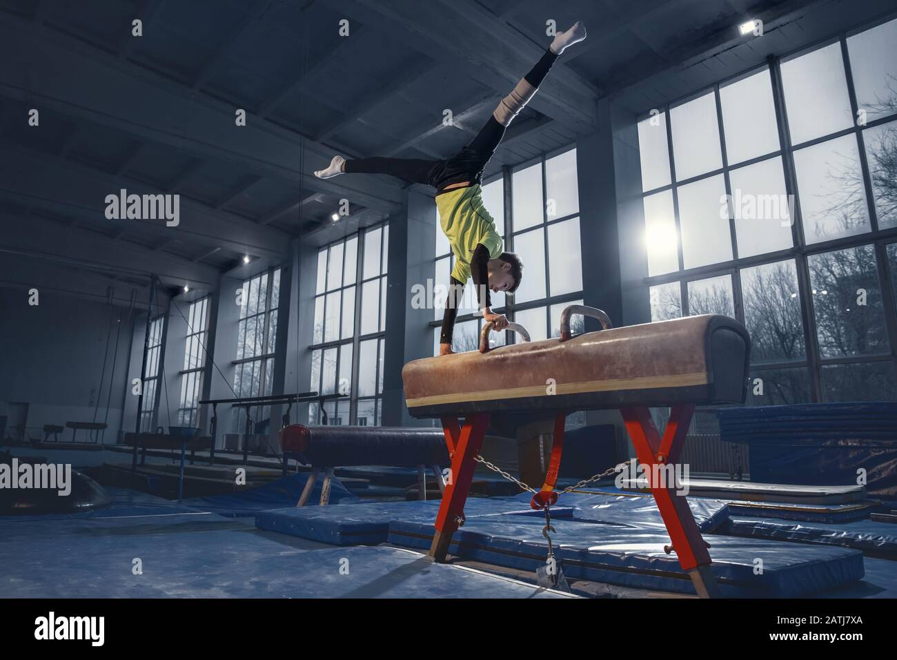Little male gymnast training in gym, flexible and active. Caucasian fit ...